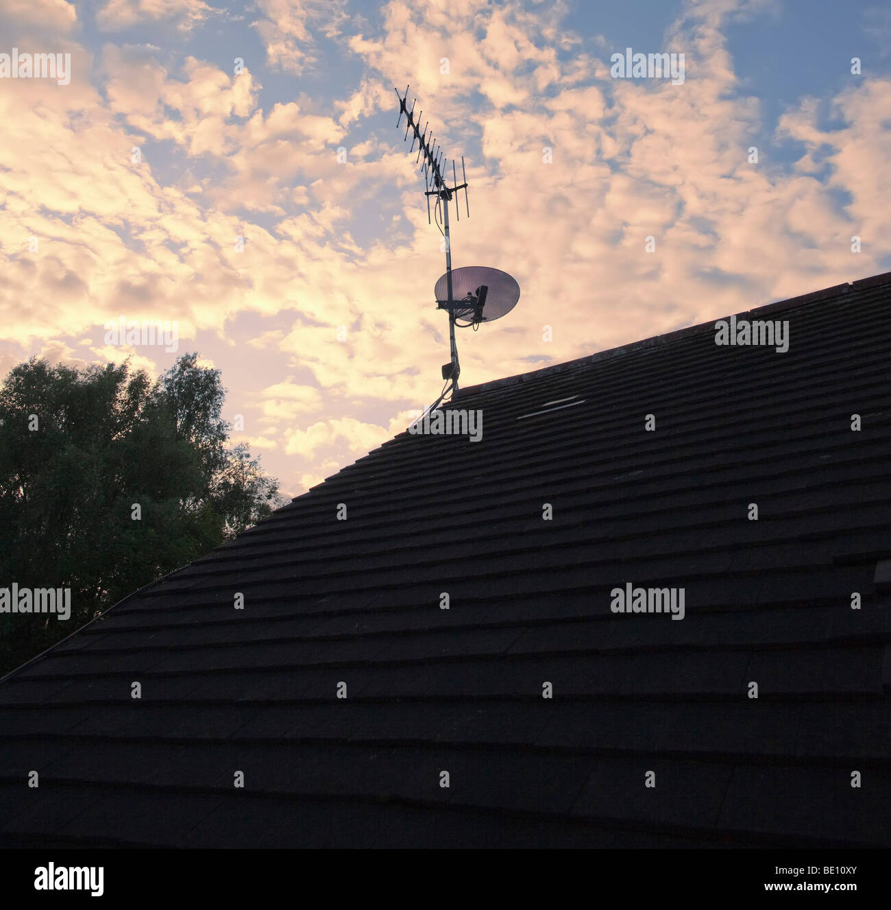 A satellite digital television arial on a roof Stock Photo - Alamy