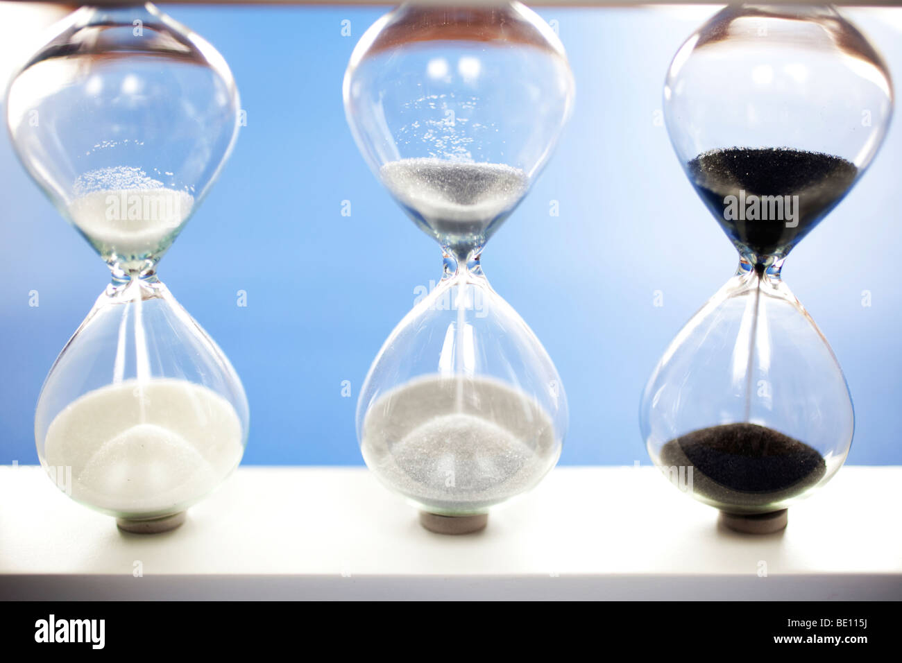 GLASS SAND CLOCKS IN A ROW Stock Photo - Alamy