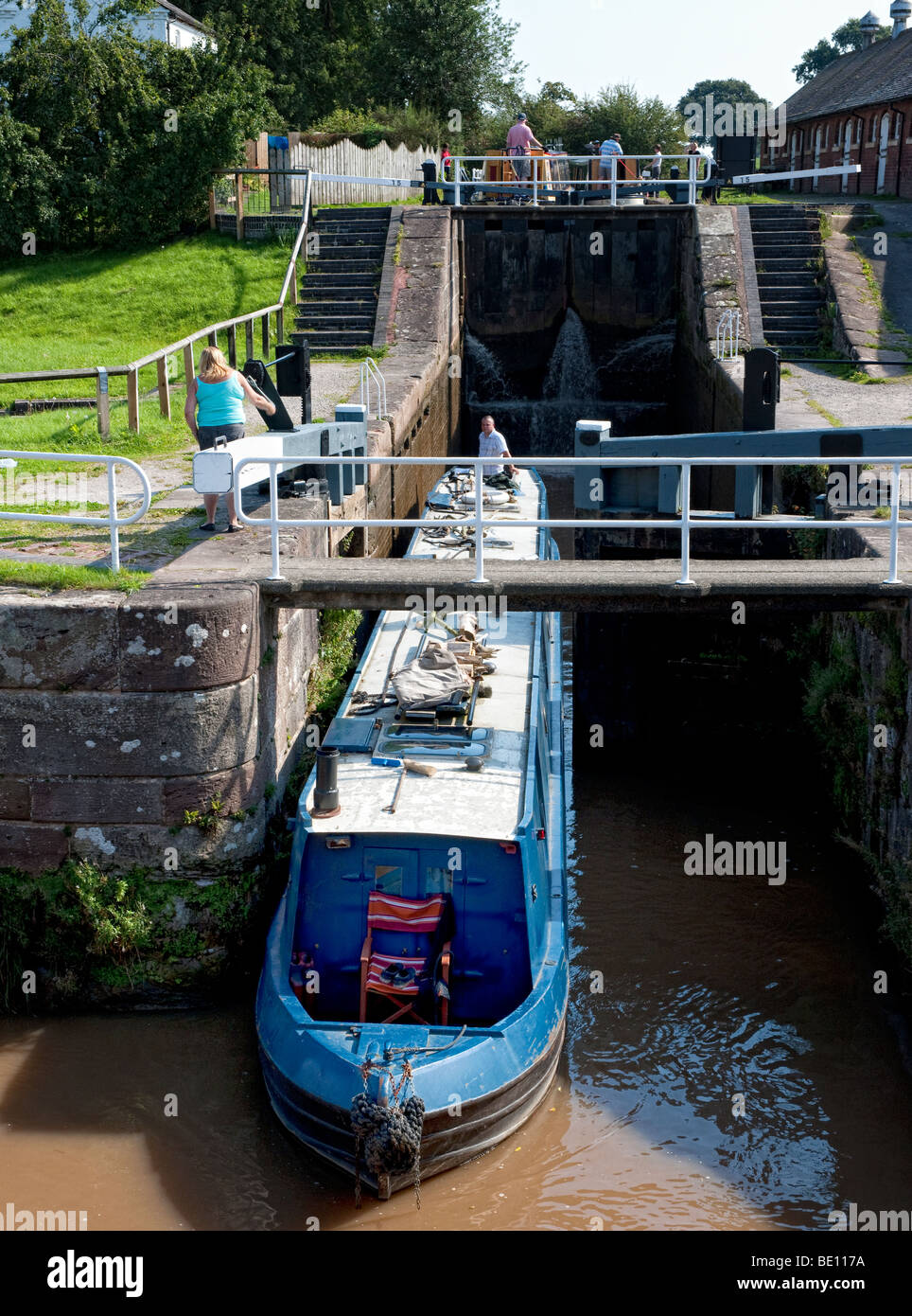 A barge passes through the Staircase Lock on the Shropshire Union Canal ...
