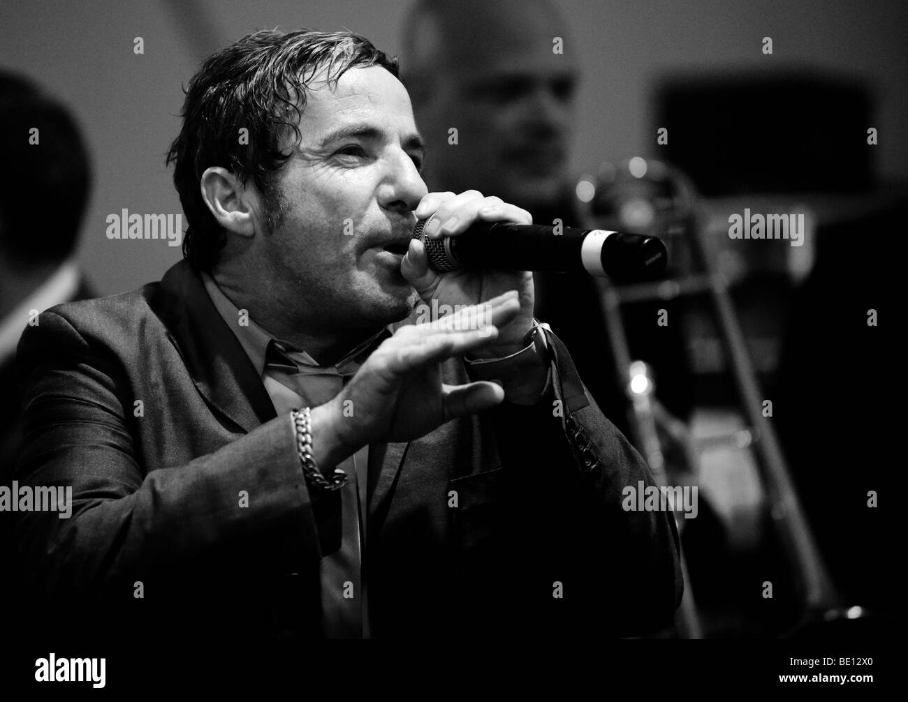 Barry Ashworth, lead singer of the Dub Pistols performing at The Glade ...
