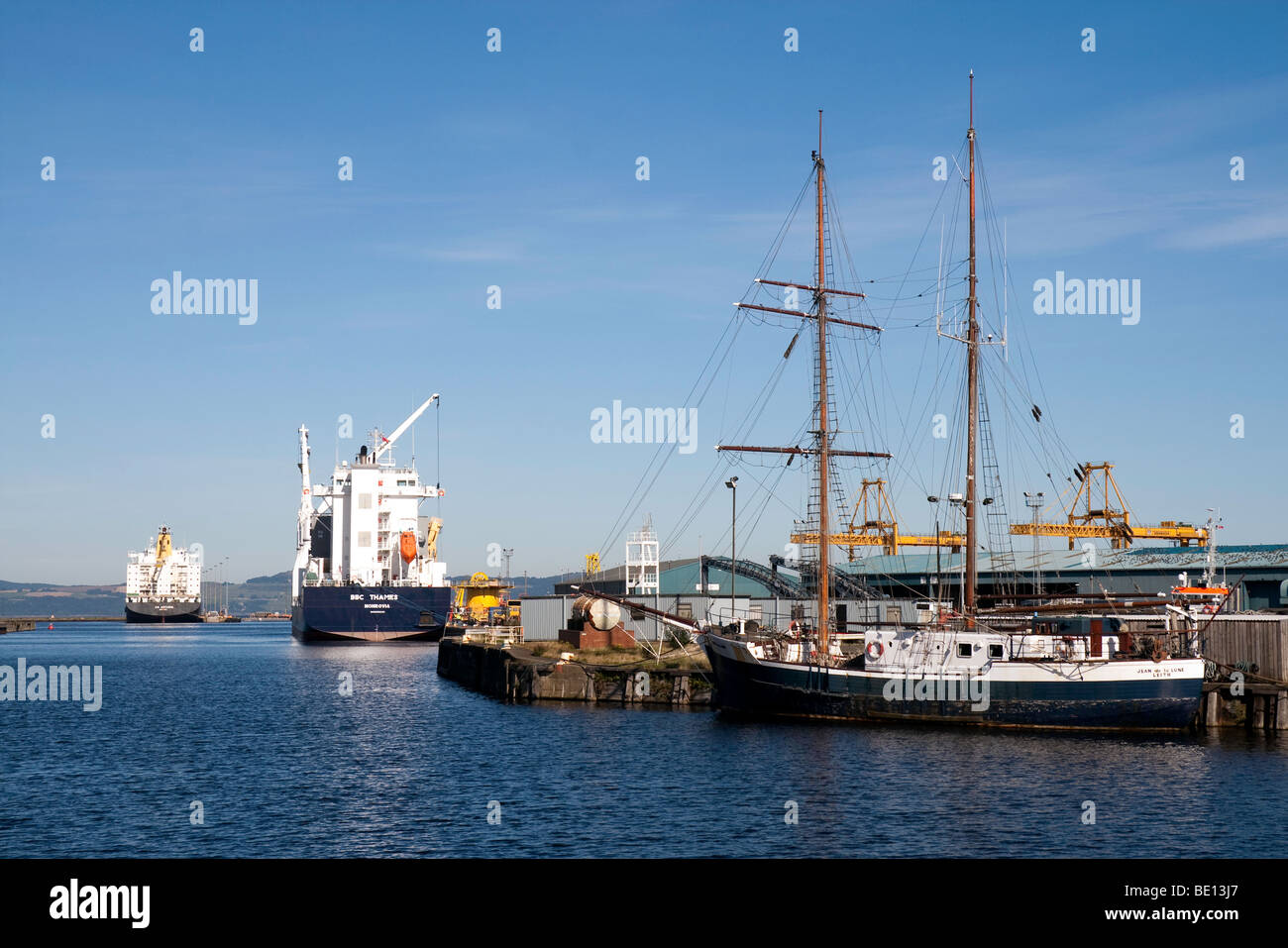 Three boats docked in Leith Docks, Edinburgh on a bright, sunny day ...