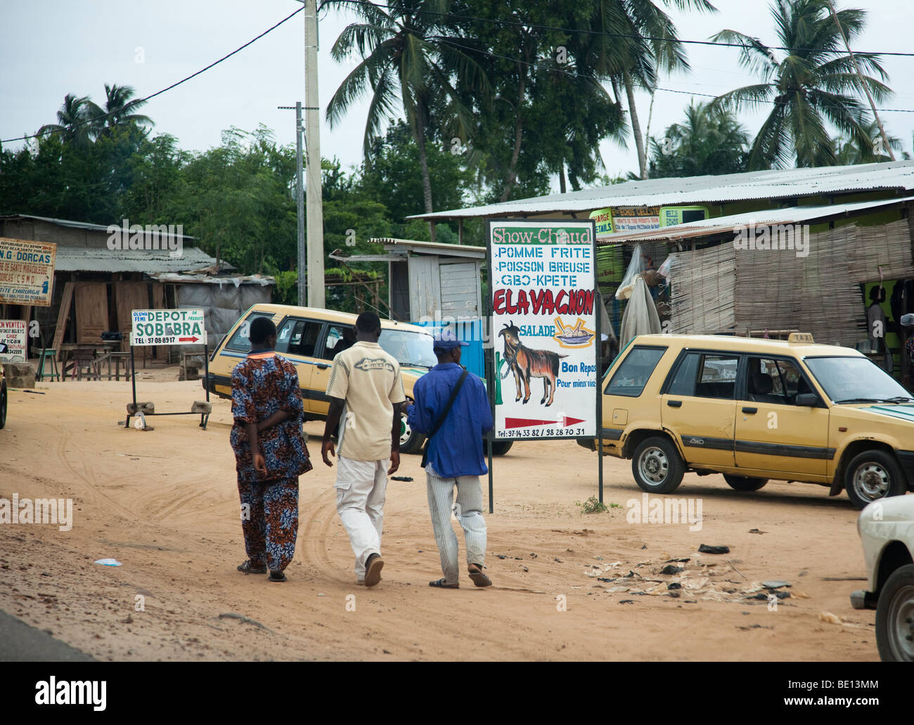 Signs line the streets of Cotonou, Benin. Due to high illiteracy rates ...