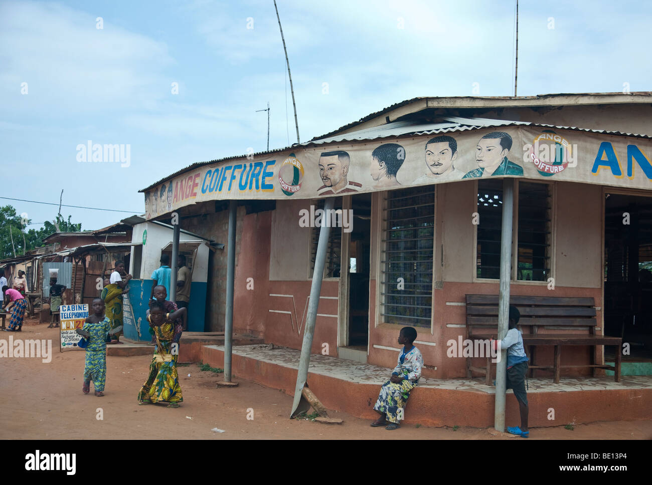Signs line the streets of Ouidah, Benin. Due to high illiteracy rates ...