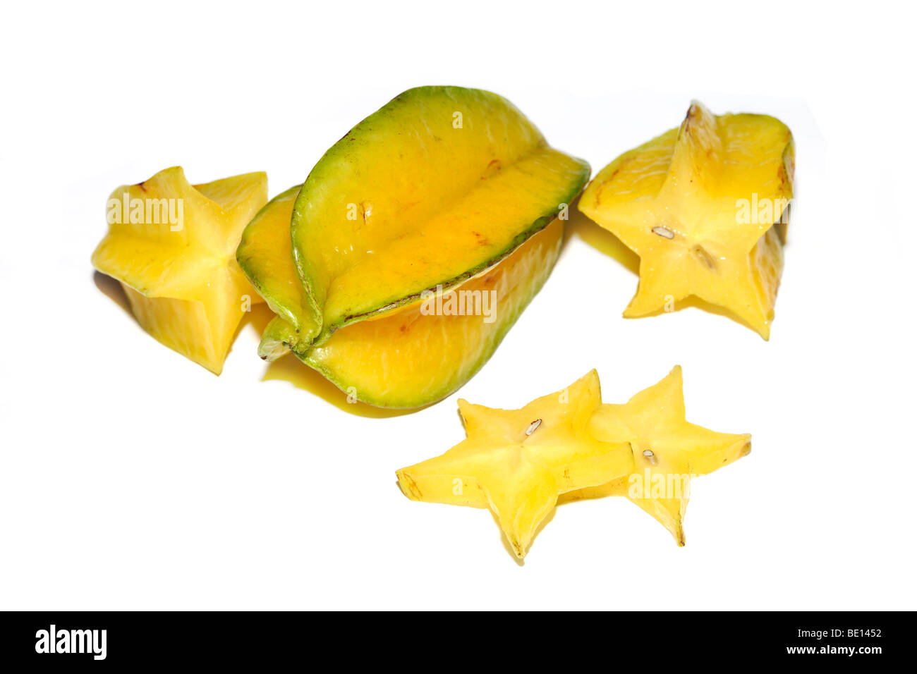 Carambola (Star Fruit) whole and sliced, on a white background Stock ...