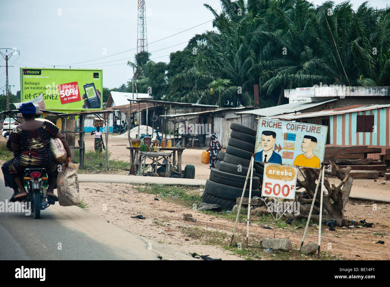 Signs line the streets of Cotonou, Benin. Due to high illiteracy rates ...