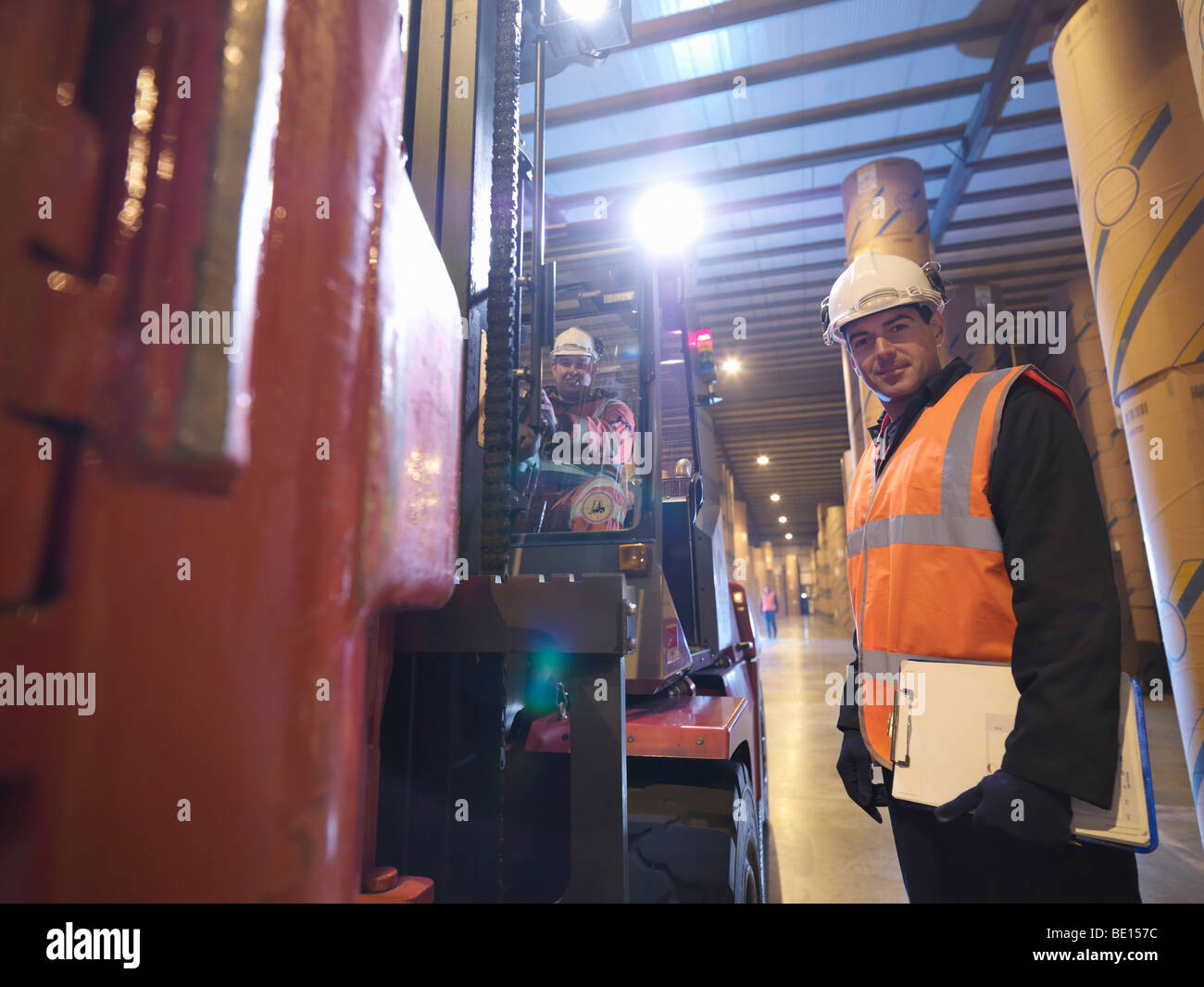 Man standing fork lift truck hi-res stock photography and images - Alamy
