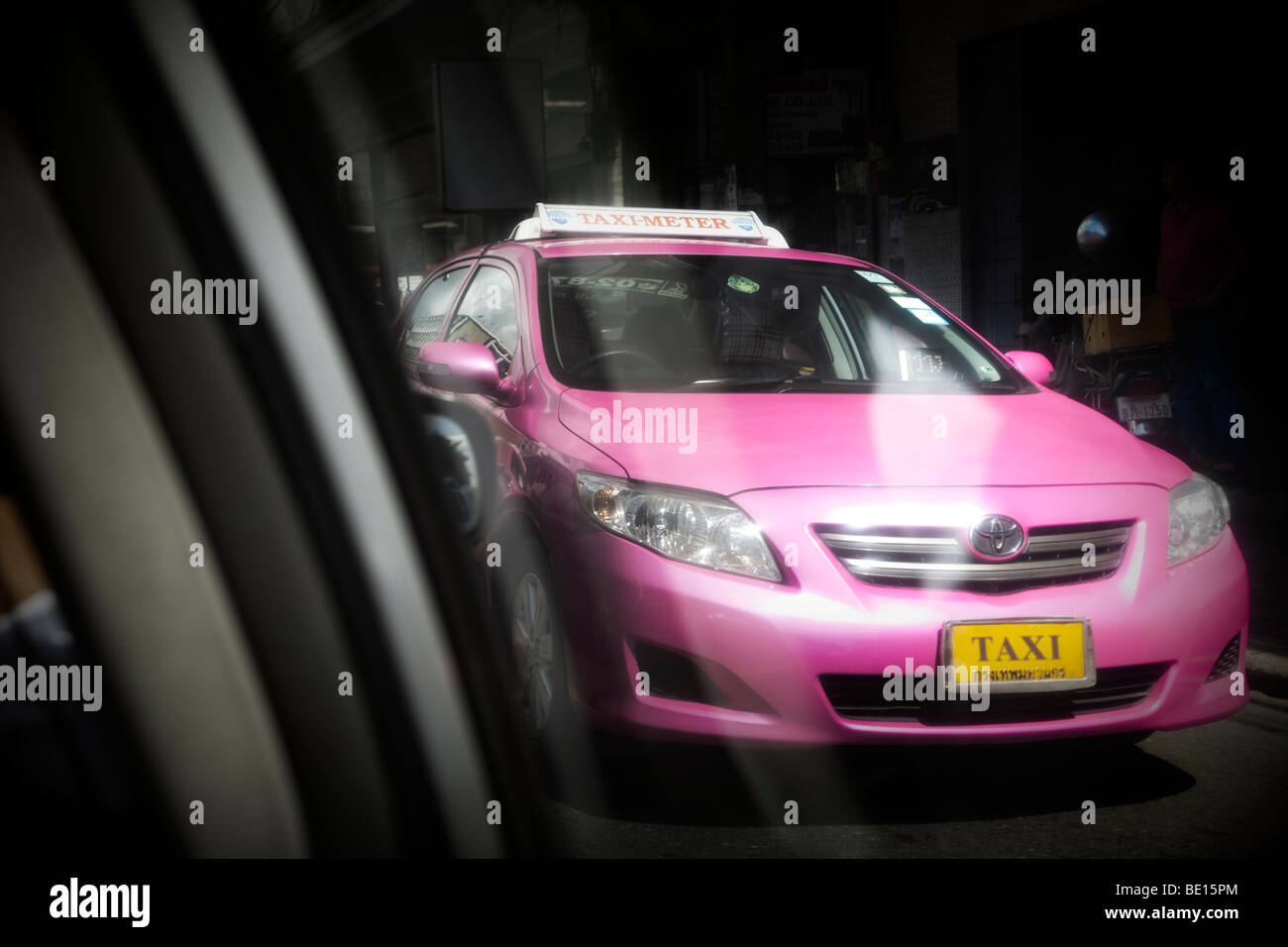Thailand, Bangkok, hot pink taxi in blurred motion Stock Photo - Alamy