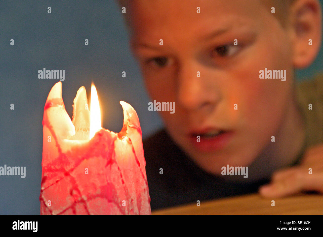 portrait of a young boy playing with fire Stock Photo - Alamy