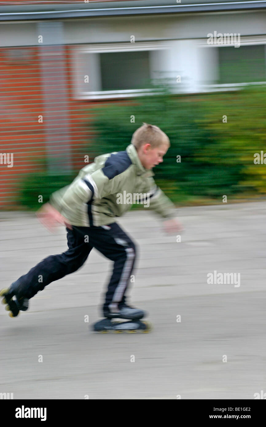 young boy in-line skating Stock Photo - Alamy