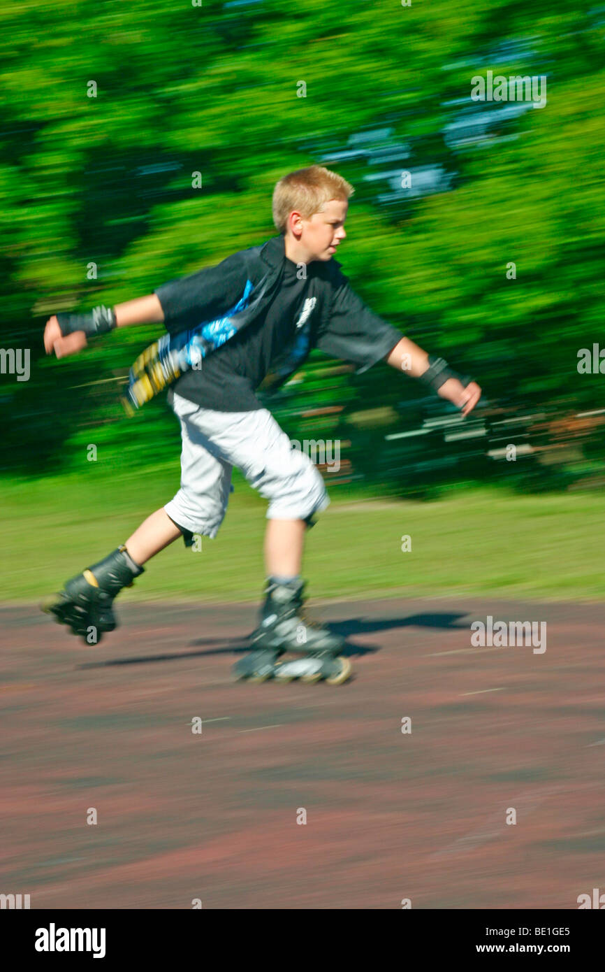young boy in-line skating Stock Photo - Alamy