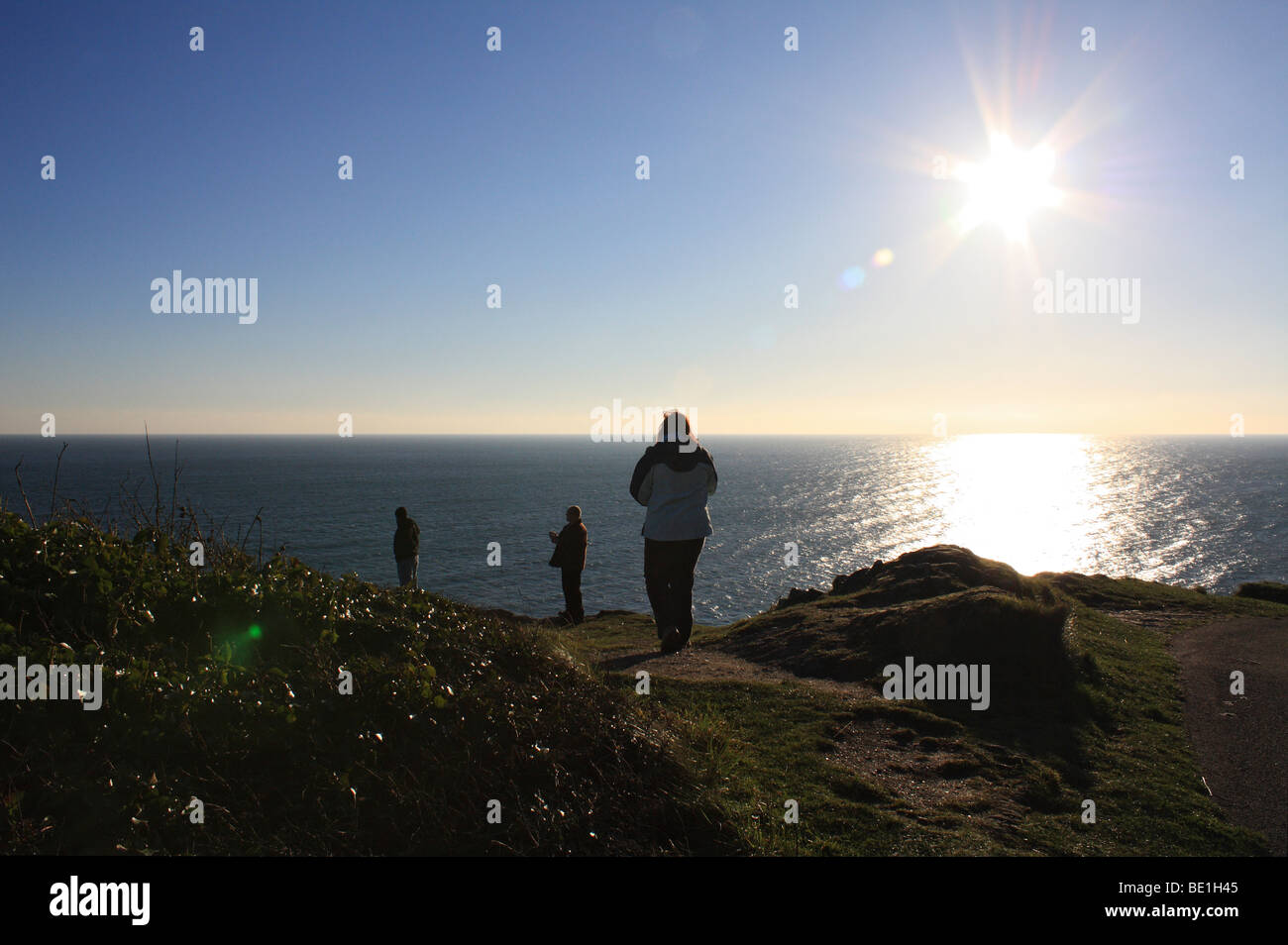 Walkers at Penlee Point near Rame Head southeast Cornwall, England, UK ...