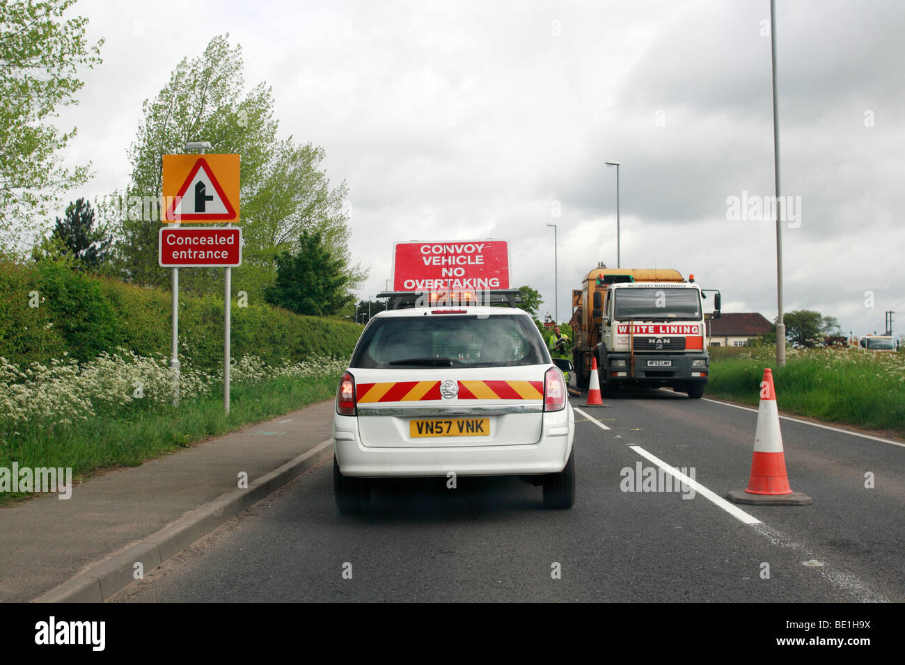 Convoy vehicle guiding traffic through road works on the B684 out of ...