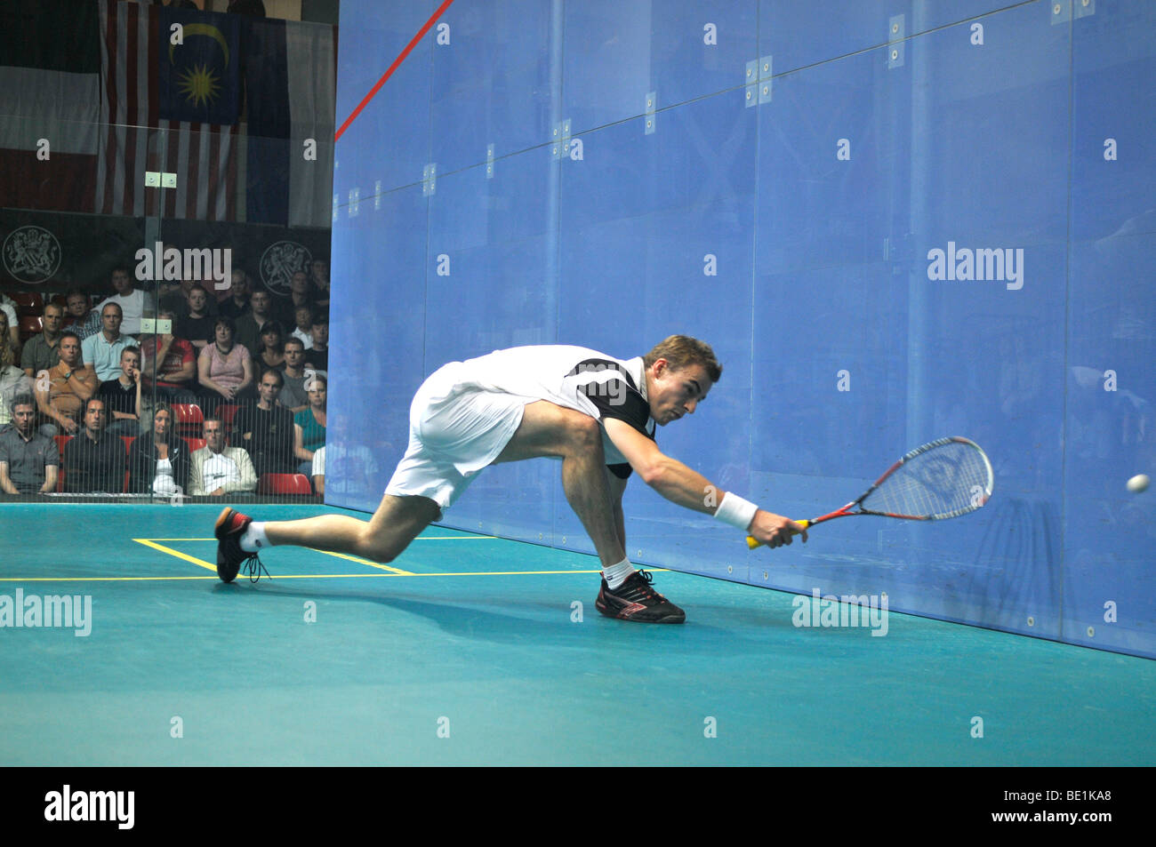 Nick Matthew plays a backhand shot at the British Open Squash ...