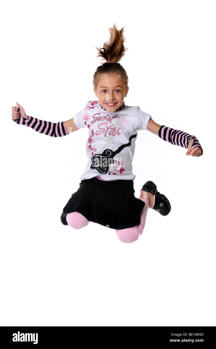 Young girl jumping isolated over a White background Stock Photo - Alamy
