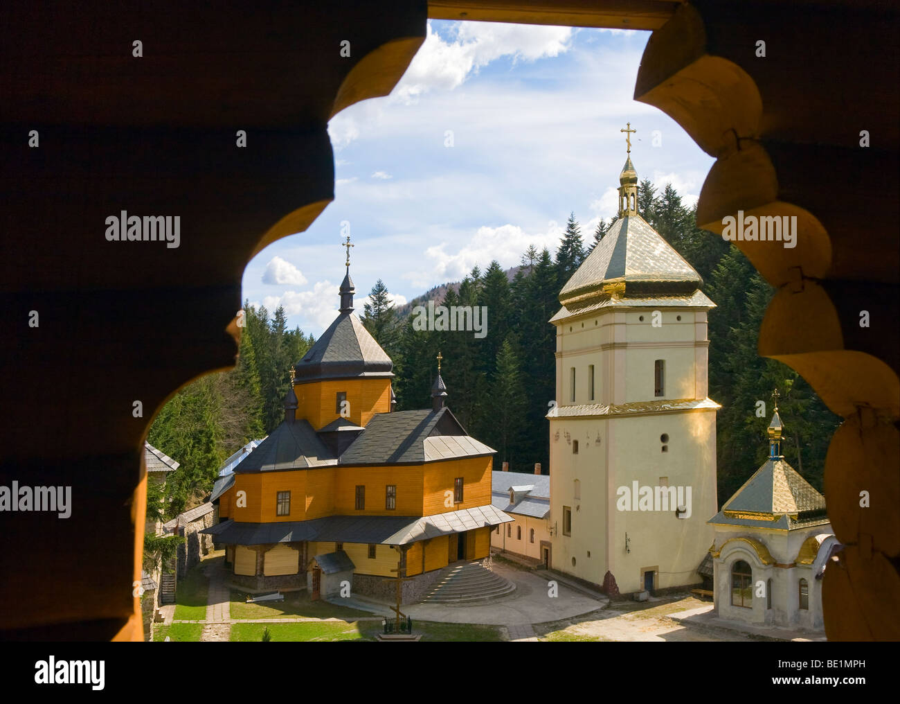 Christian orthodox monastery Courtyard view through the wooden log ...