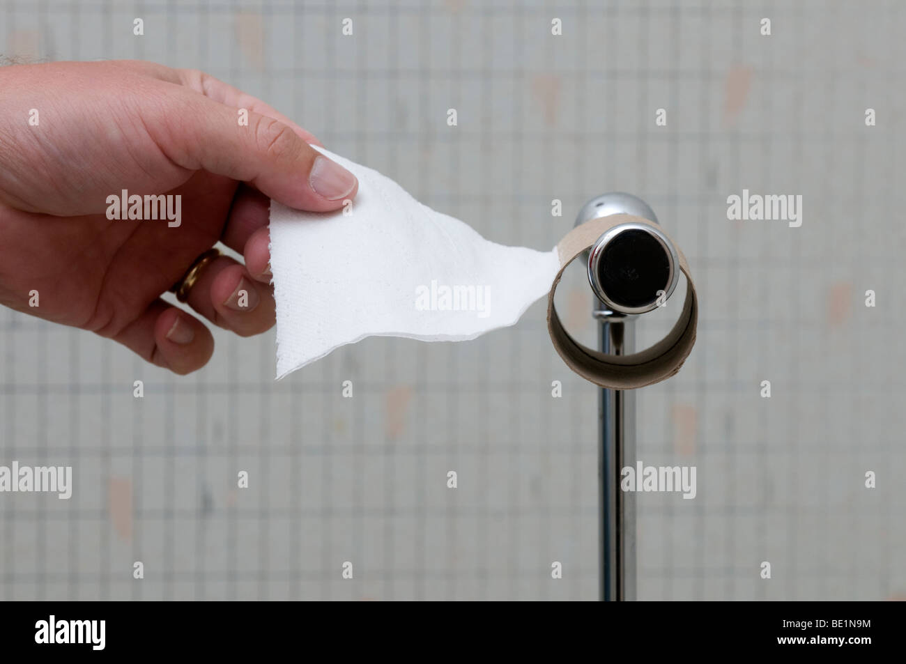Getting stranded with the last sheet of bathroom tissue Stock Photo - Alamy
