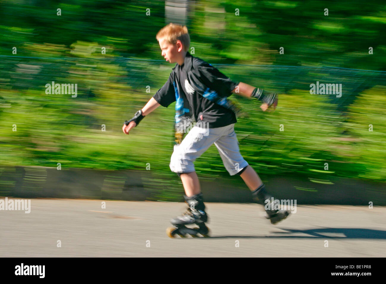 young boy in-line skating Stock Photo - Alamy