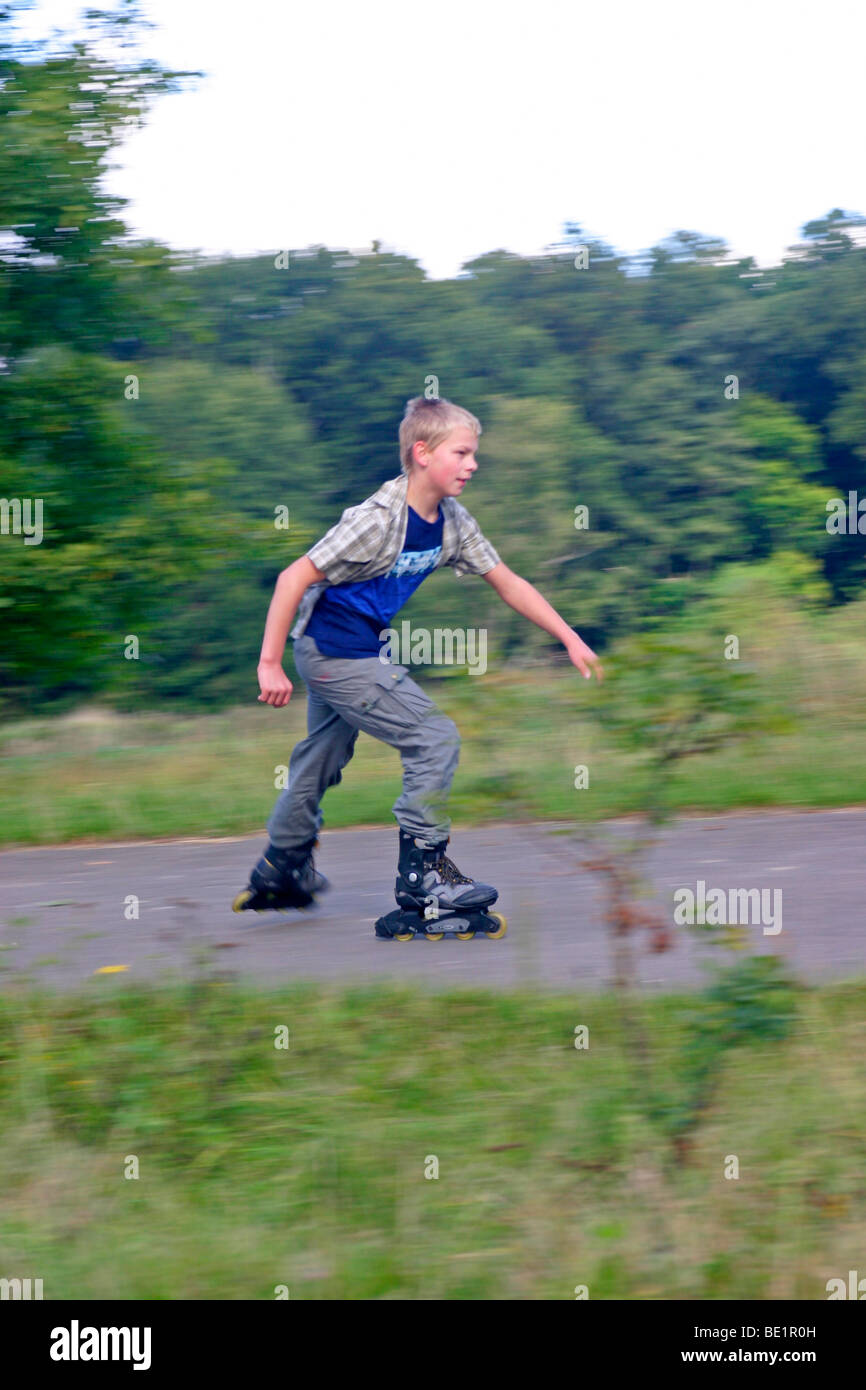 young boy in-line skating Stock Photo - Alamy