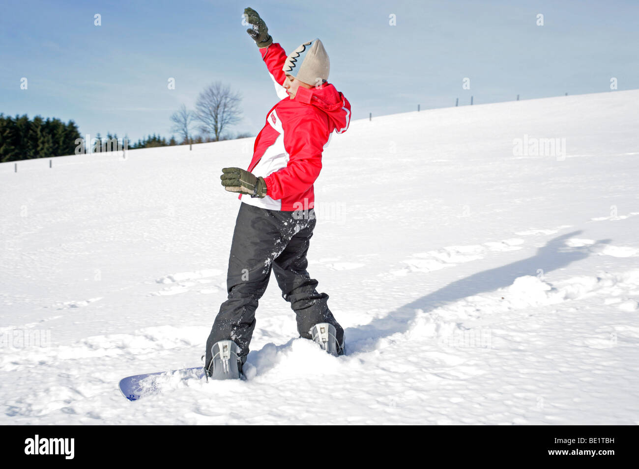 teenagers learning to snowboard Stock Photo - Alamy