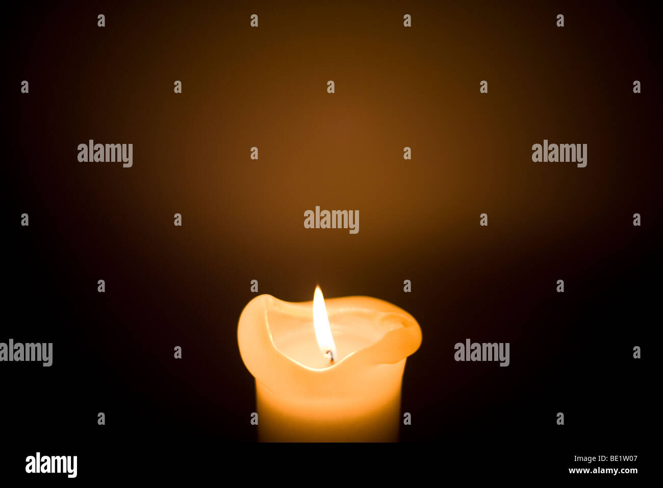 A candle buring Stock Photo - Alamy