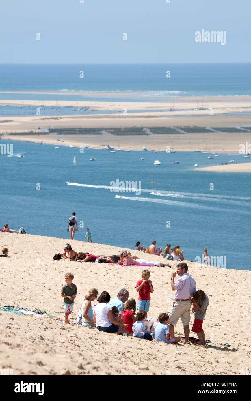 Family sitting at beach france hi-res stock photography and images - Alamy