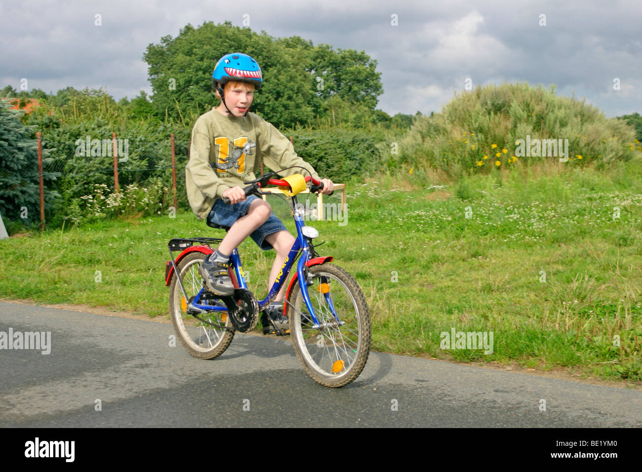 young boy cycling Stock Photo - Alamy