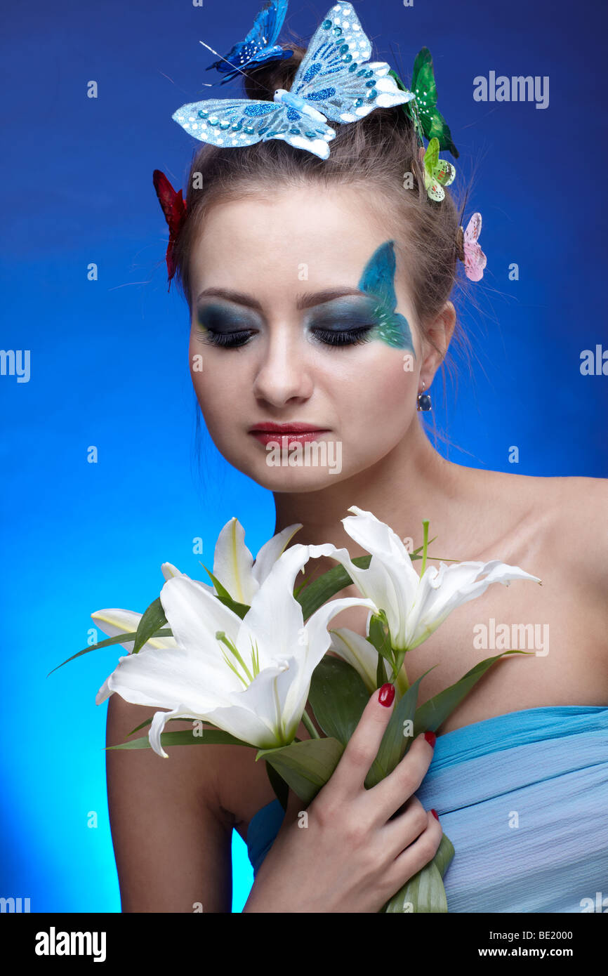 portrait of beautiful model with butterfly bodyart and artificail ...