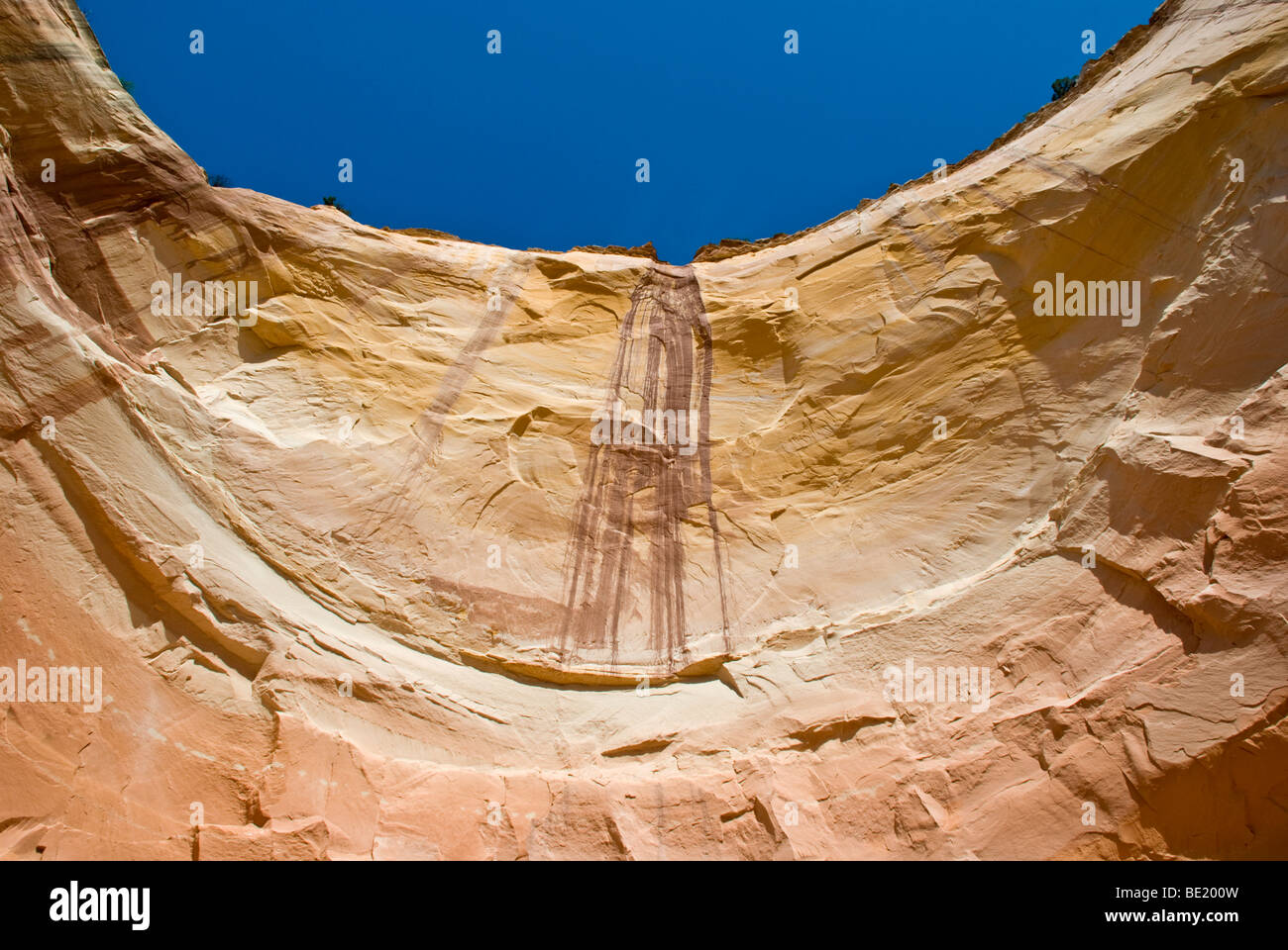 Looking up at the rim of sandstone cliffs; "Echo Amphitheater" is aptly ...
