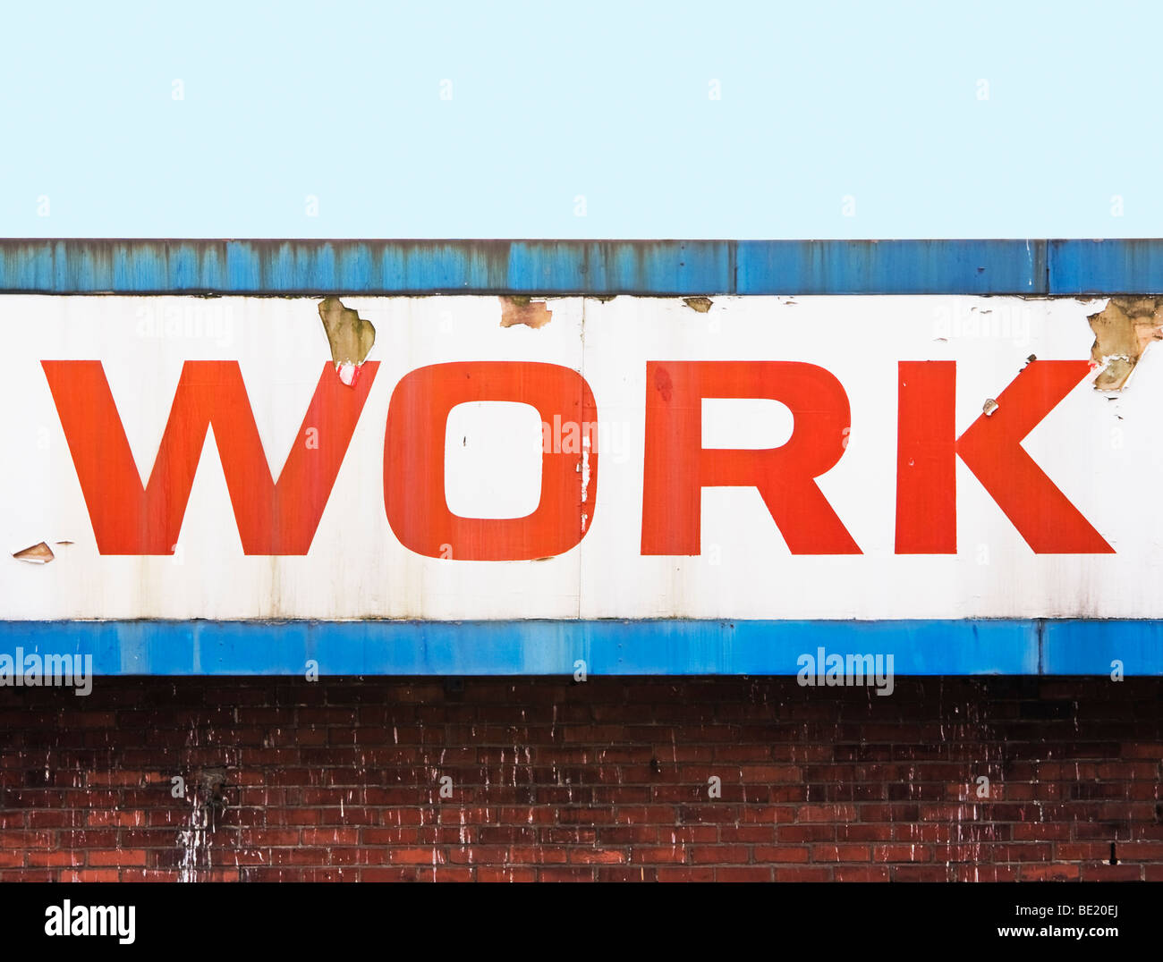 work sign mounted on roof eave Stock Photo - Alamy