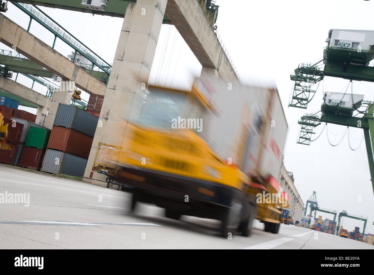 Container truck teu teus blurred moving box boxes Stock Photo - Alamy