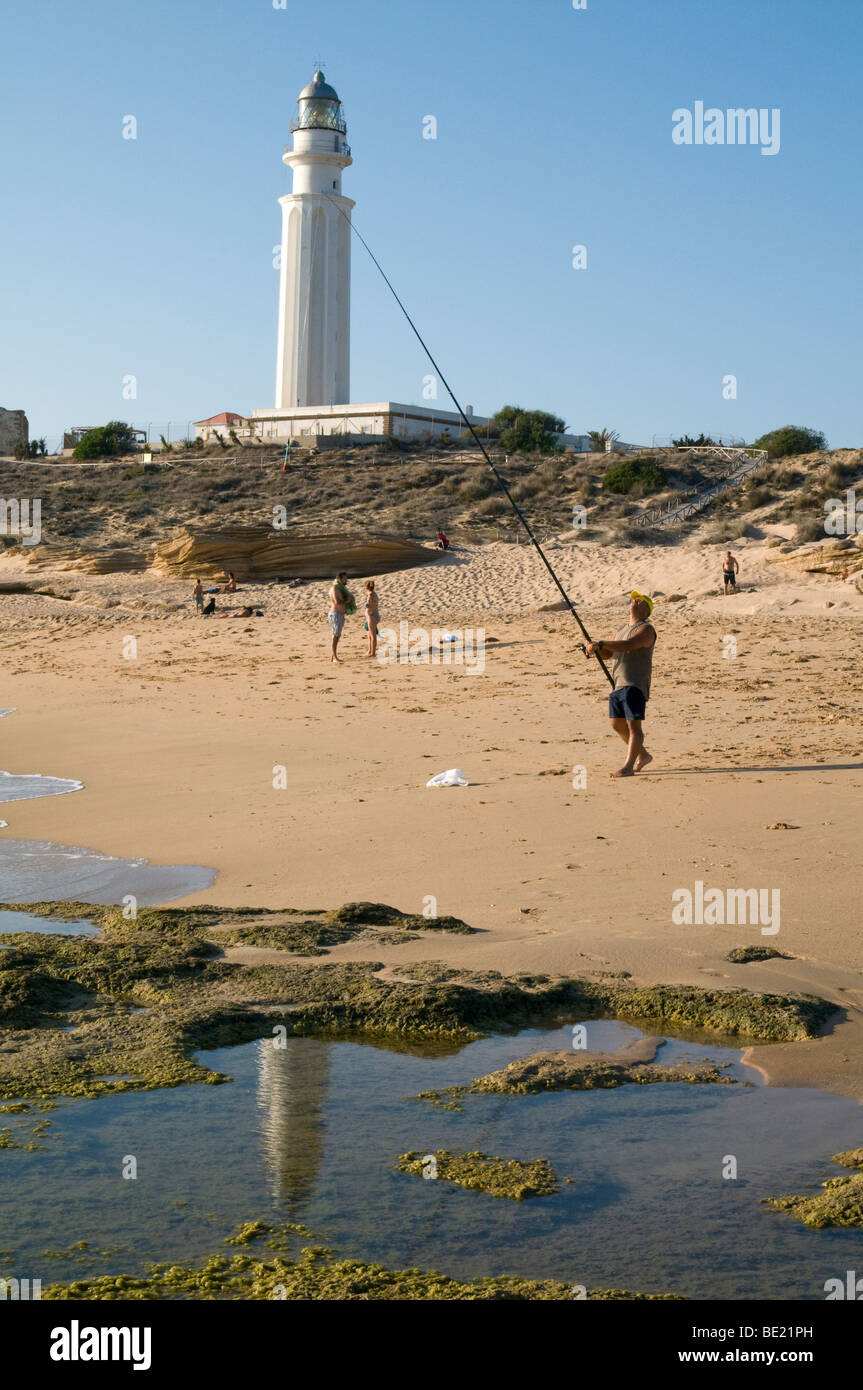 Spain. Tourists on the beaches by the lighthouse around Cape Trafalgar ...
