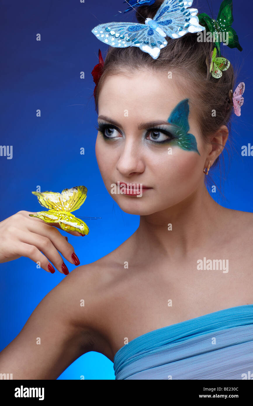portrait of beautiful model with butterfly bodyart with artificail ...