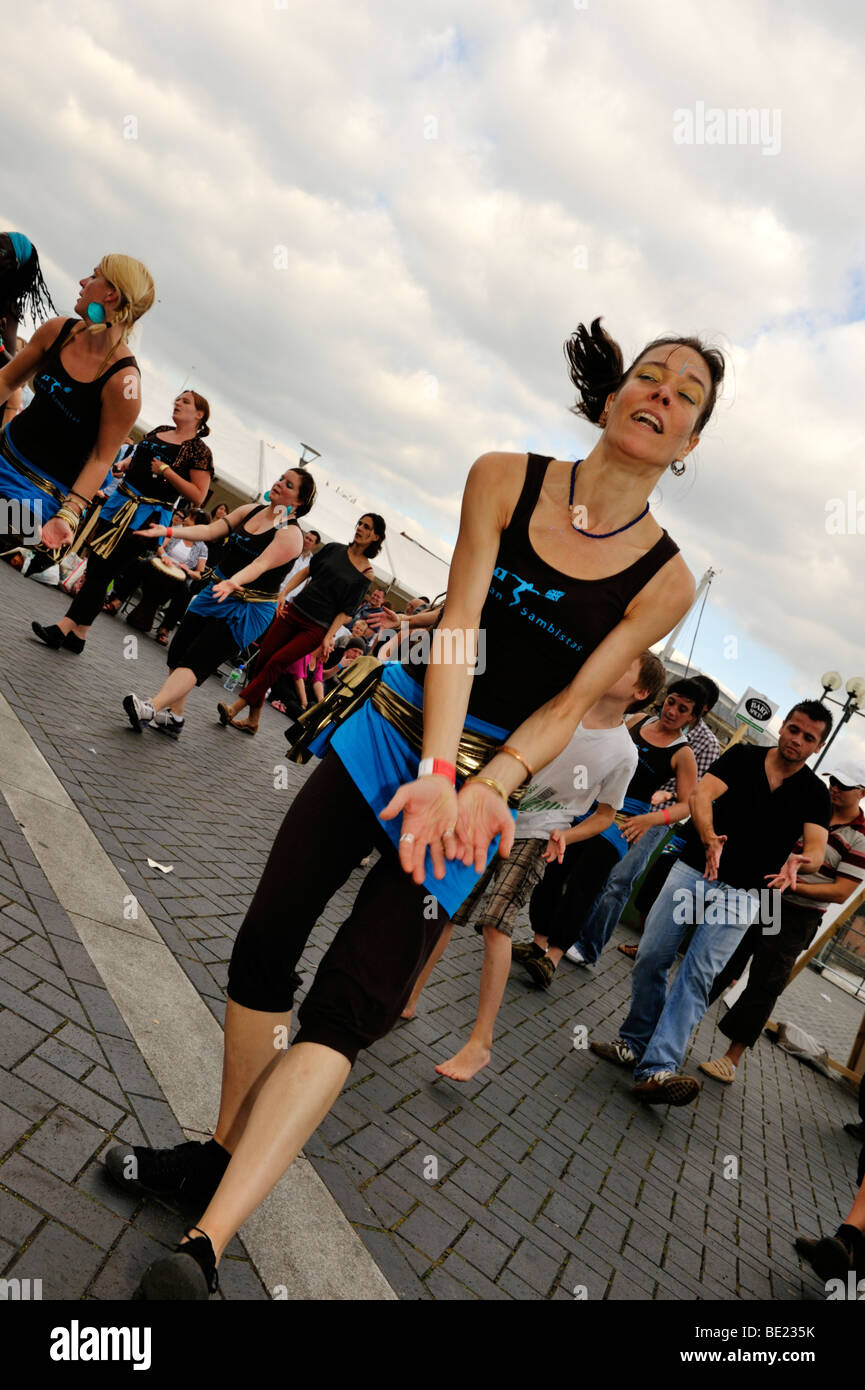 Exuberant young woman Dancing at daytime festival Stock Photo - Alamy