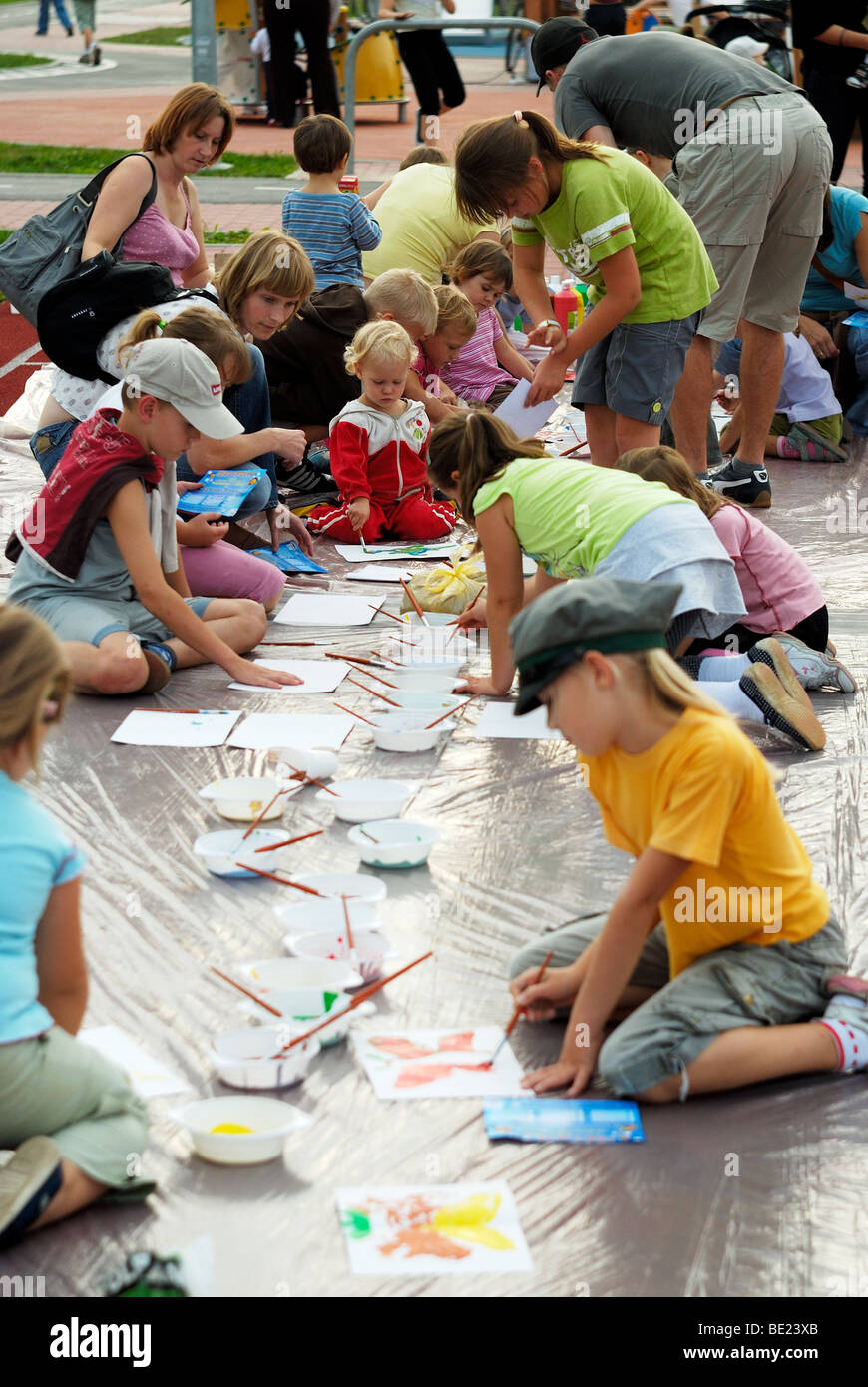 Children are having fun painting pictures Stock Photo - Alamy
