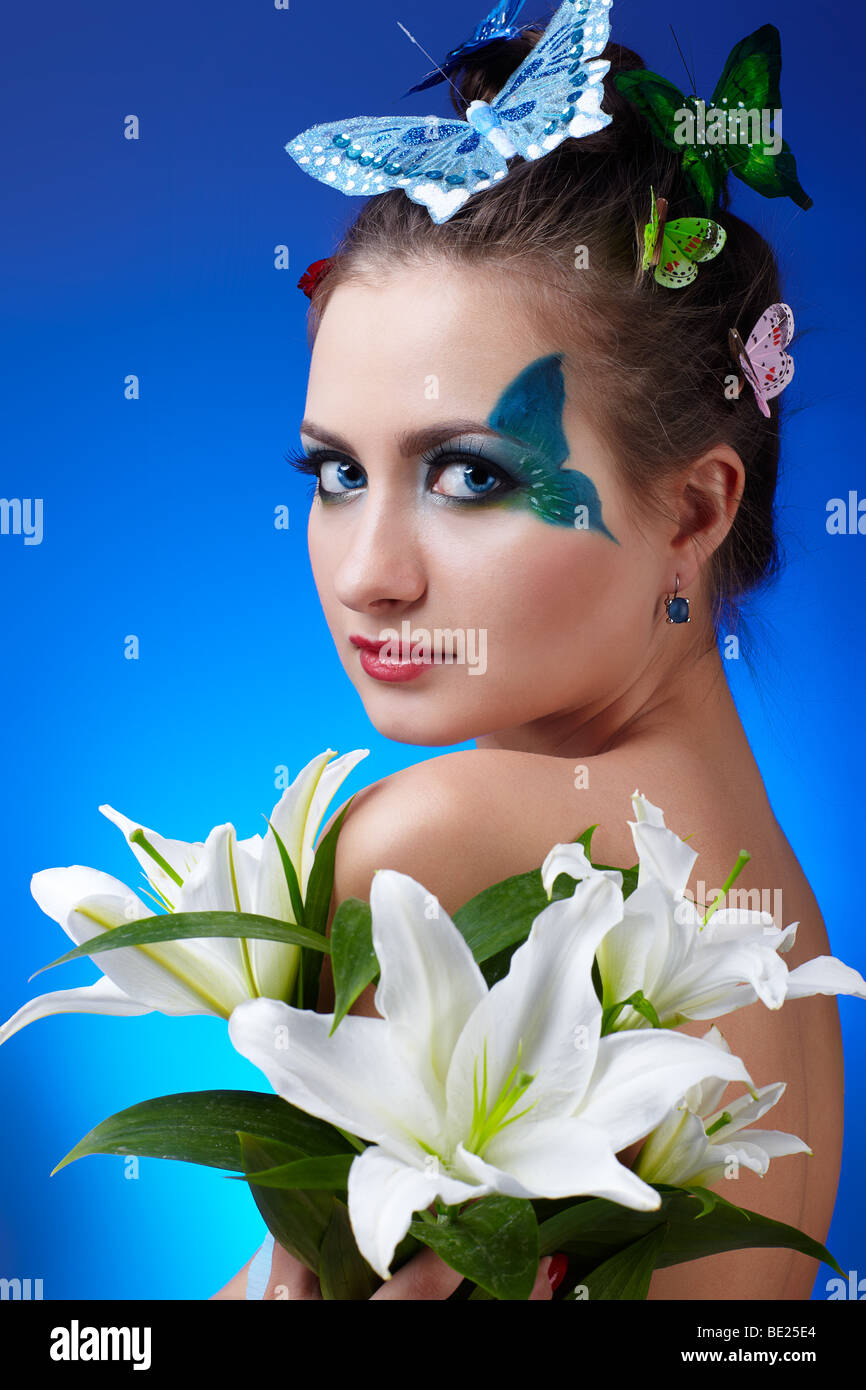 portrait of beautiful model with butterfly bodyart and artificail ...