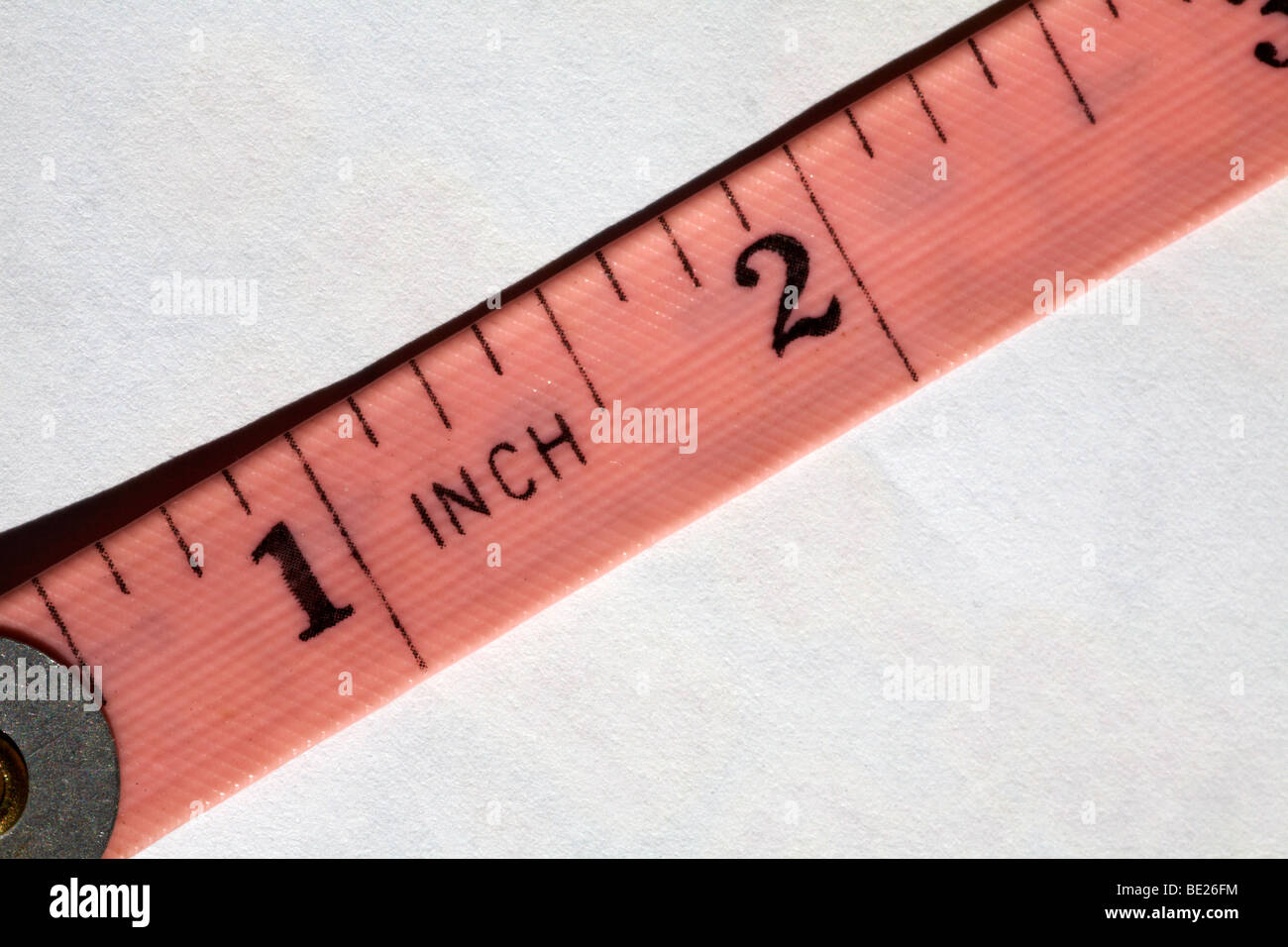 Beginning of measuring tape close up - tape measure set on white ...