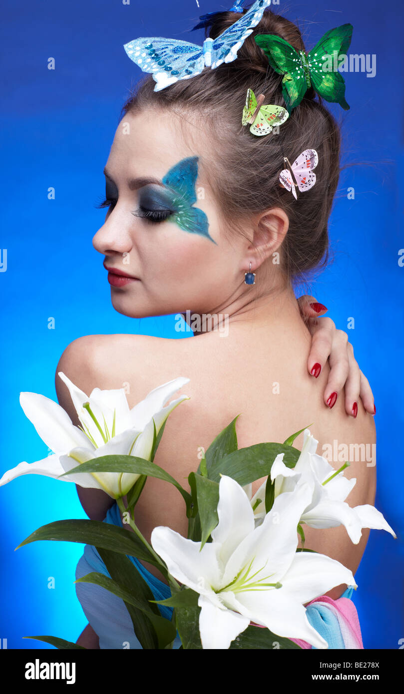 portrait of beautiful model with butterfly bodyart and artificail ...