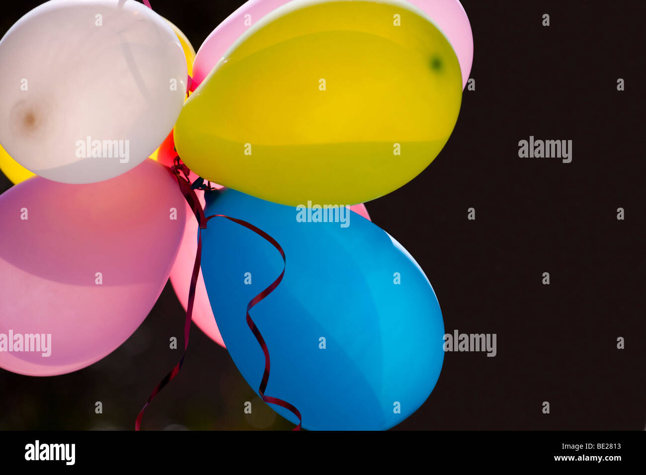 Multi coloured floating balloons Stock Photo - Alamy