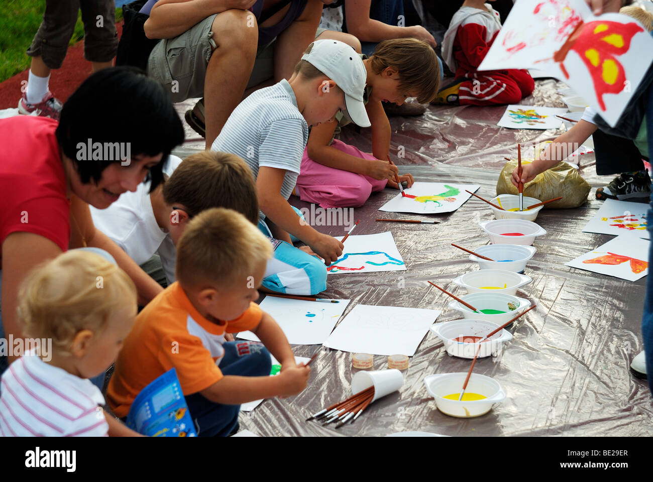 Children are having fun painting pictures Stock Photo - Alamy