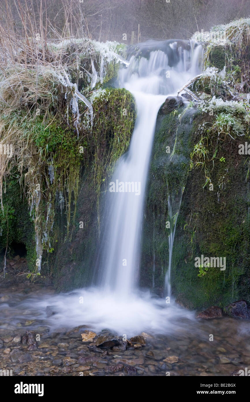 Waterfall on the River Lathkill at Lathkill Dale in winter in the Peak ...
