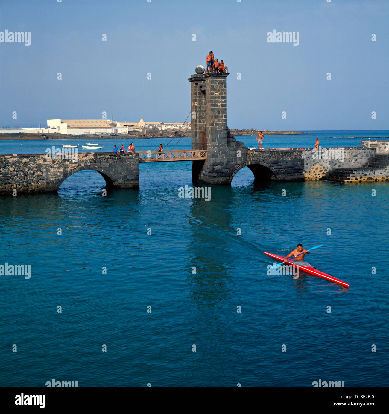 Canoe and bridge in sea off Lanzarote Stock Photo - Alamy