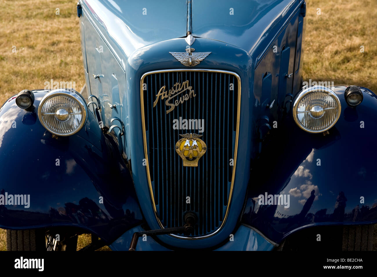 The radiator grill and headlights of an Austin 7 classic car on display ...