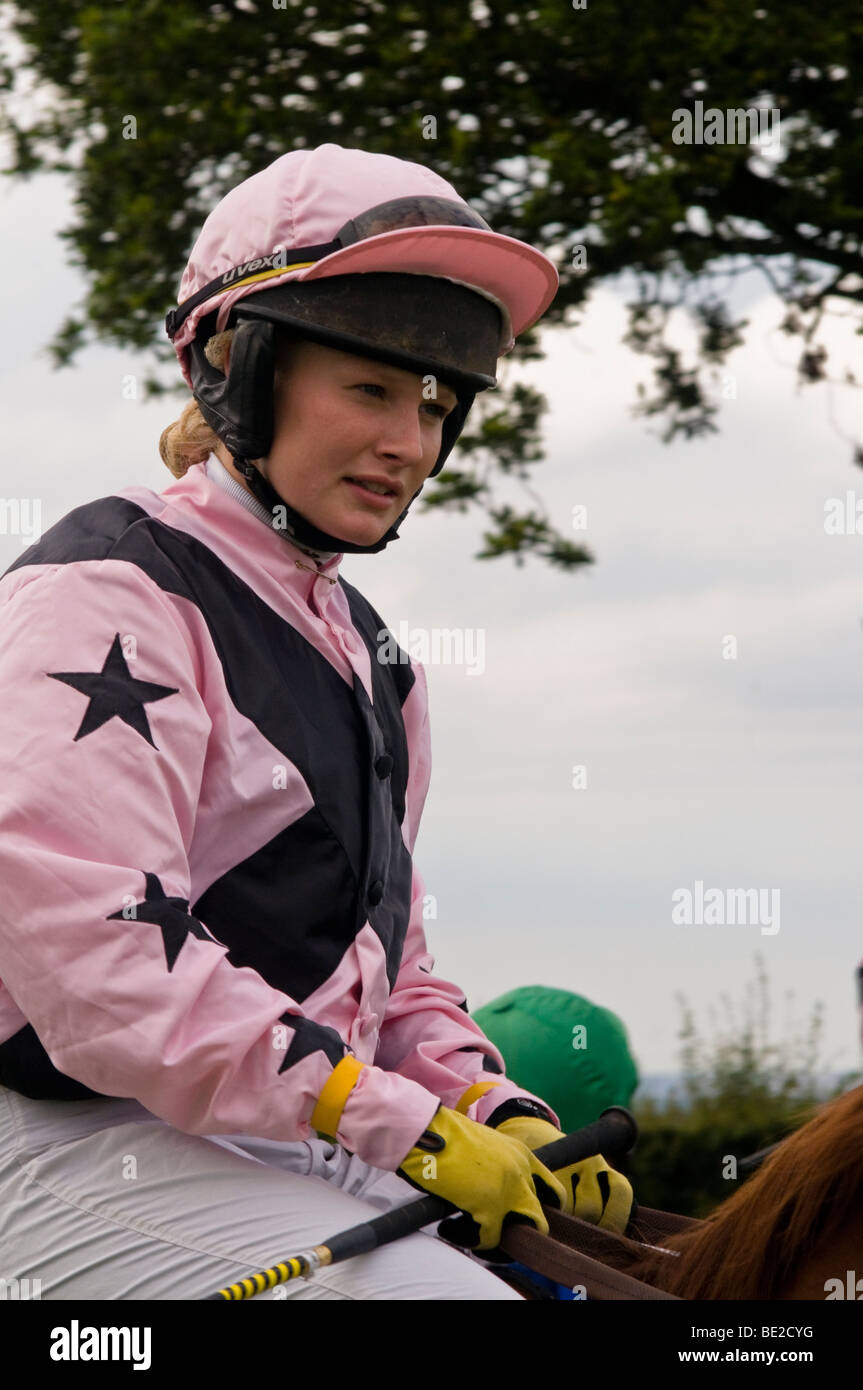 A young female jockey at the start of a horse race, Beverley, East ...