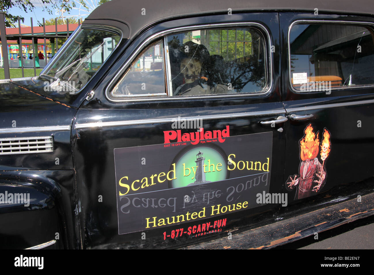 Skeleton posed as driver in hearse promoting Halloween fun house at Rye ...