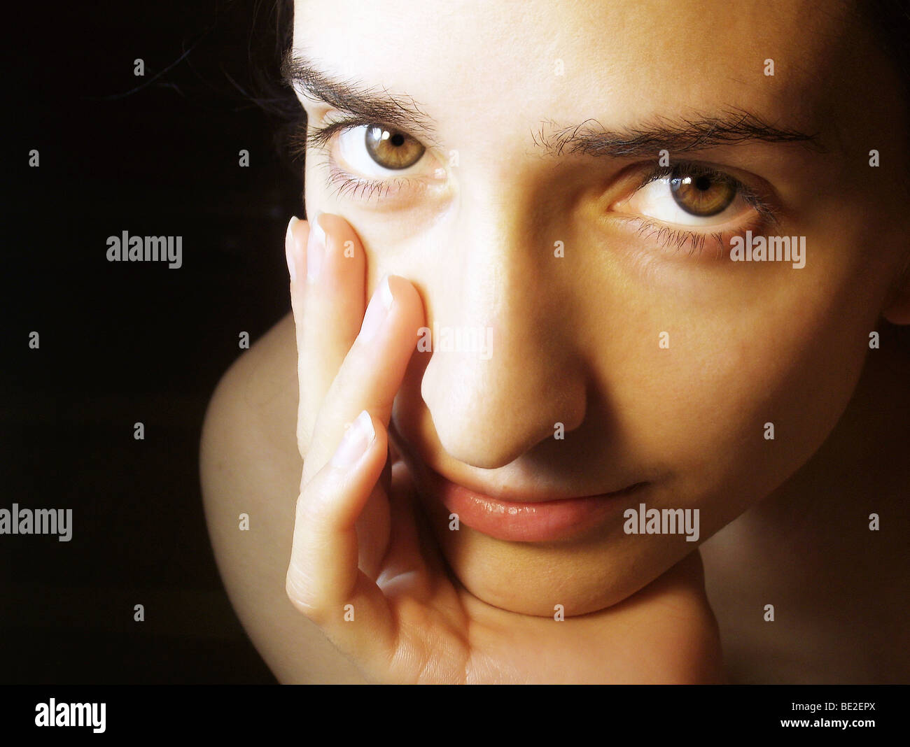 Portrait young woman without a make-up on a black background Stock ...