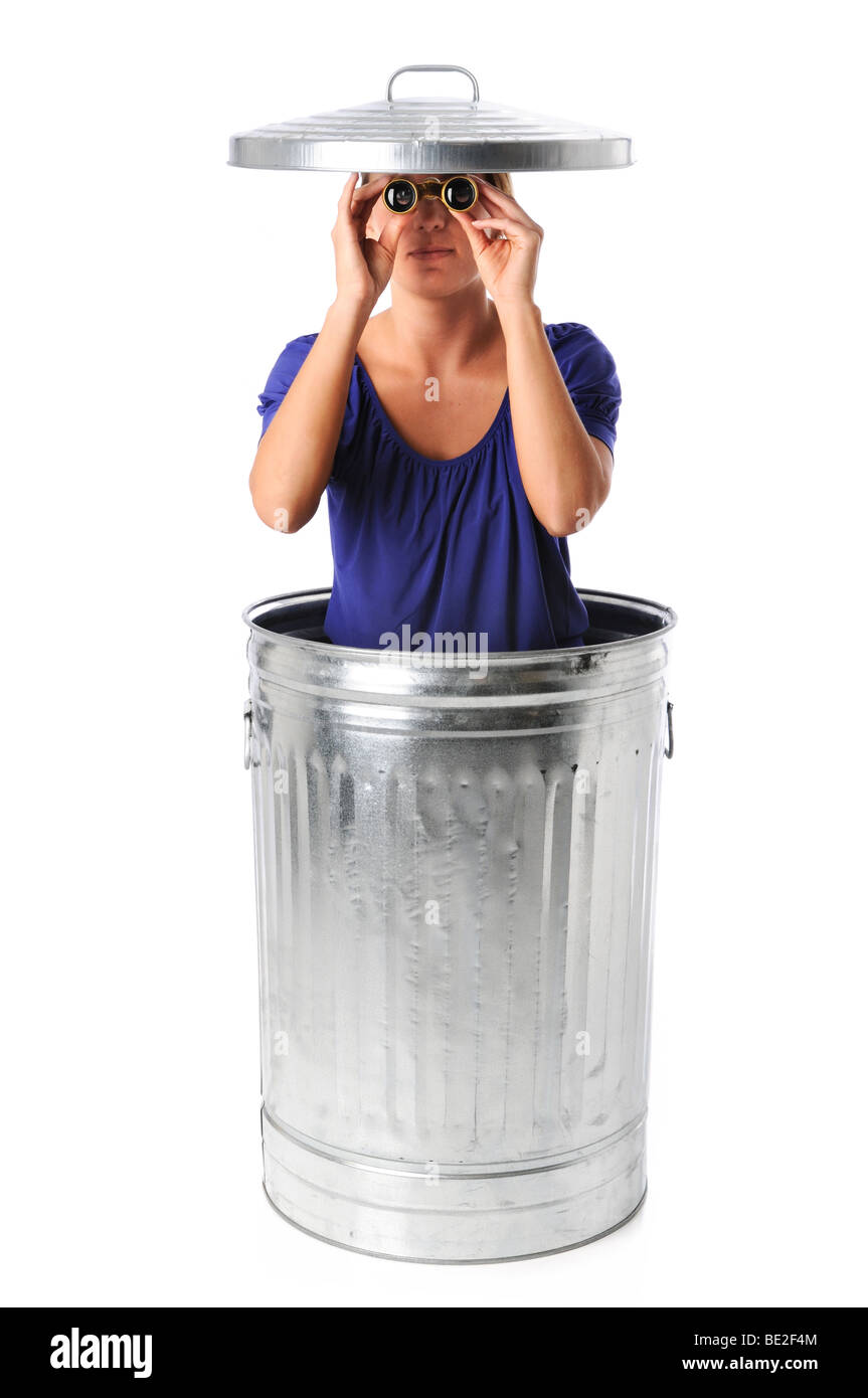 Young woman in trash can Cut Out Stock Images & Pictures - Alamy