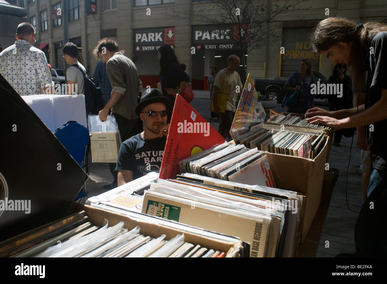 Music lovers sort through stacks and stacks of vinyl records at the DJ ...