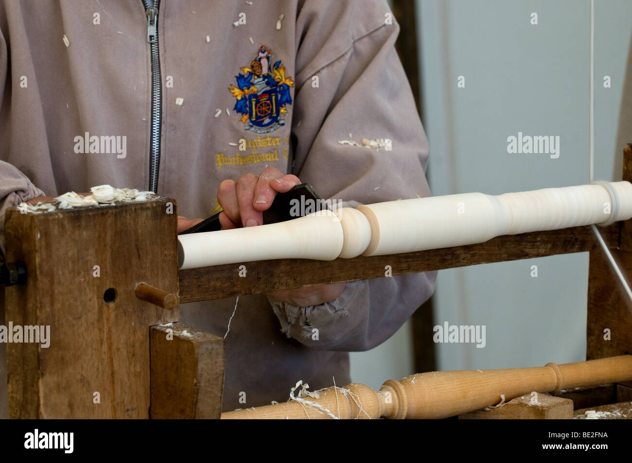 A traditional bodger turning a chair leg on a lathe at the Essex County ...