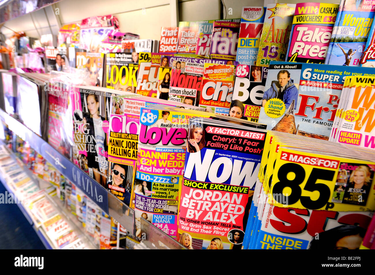 Magazines on a stand in a newsagents Stock Photo - Alamy