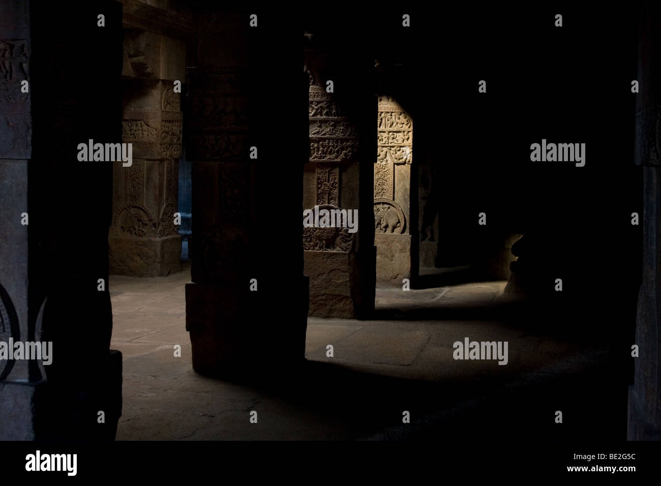 Hindu temple columns lightened by beam of light, Badami, Karnataka ...
